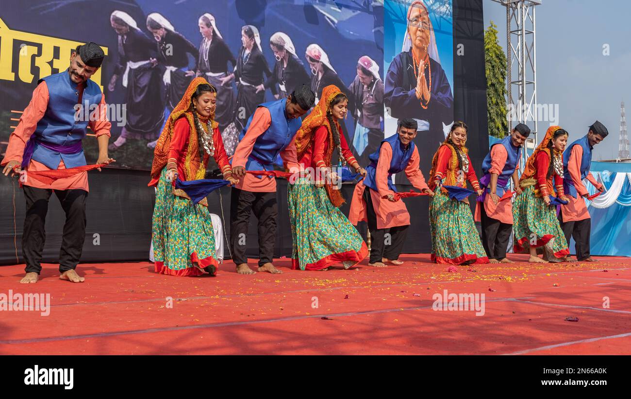 Tribal men and women wearing traditional attire dancing at the Johar ...