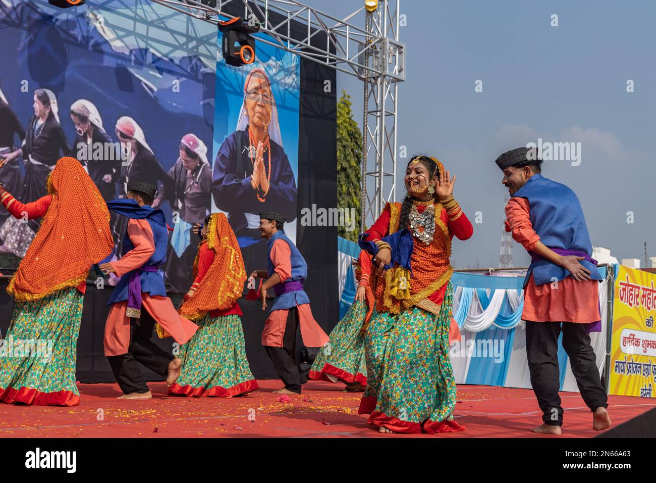 Tribal men and women wearing traditional attire dancing at the Johar ...