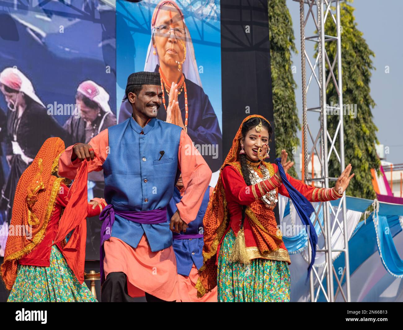Tribal men and women wearing traditional attire dancing at the Johar ...