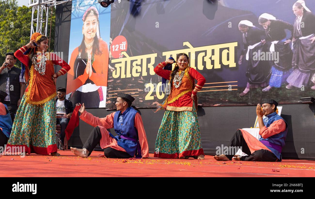 Tribal men and women wearing traditional attire dancing at the Johar ...