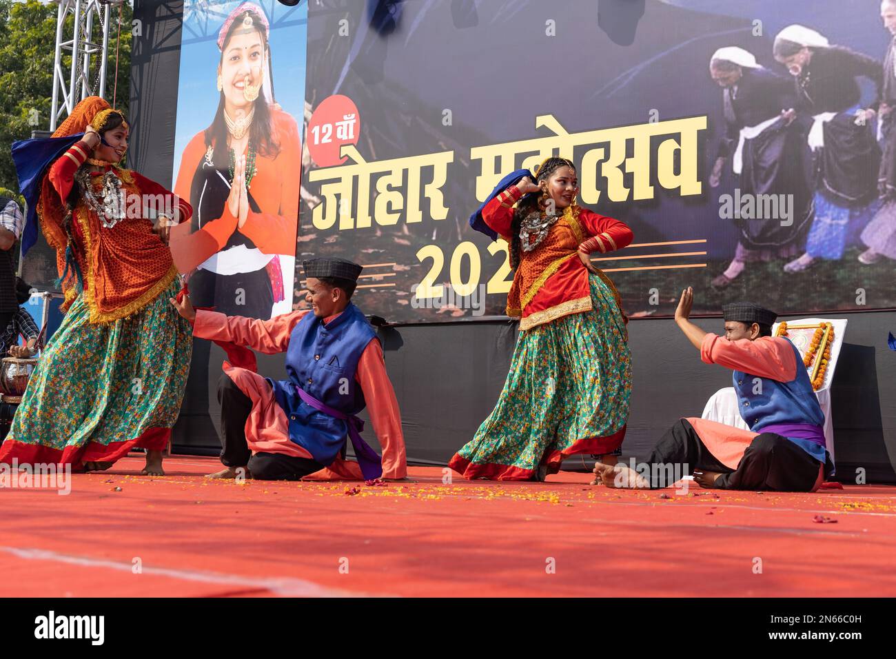 Tribal men and women wearing traditional attire dancing at the Johar ...