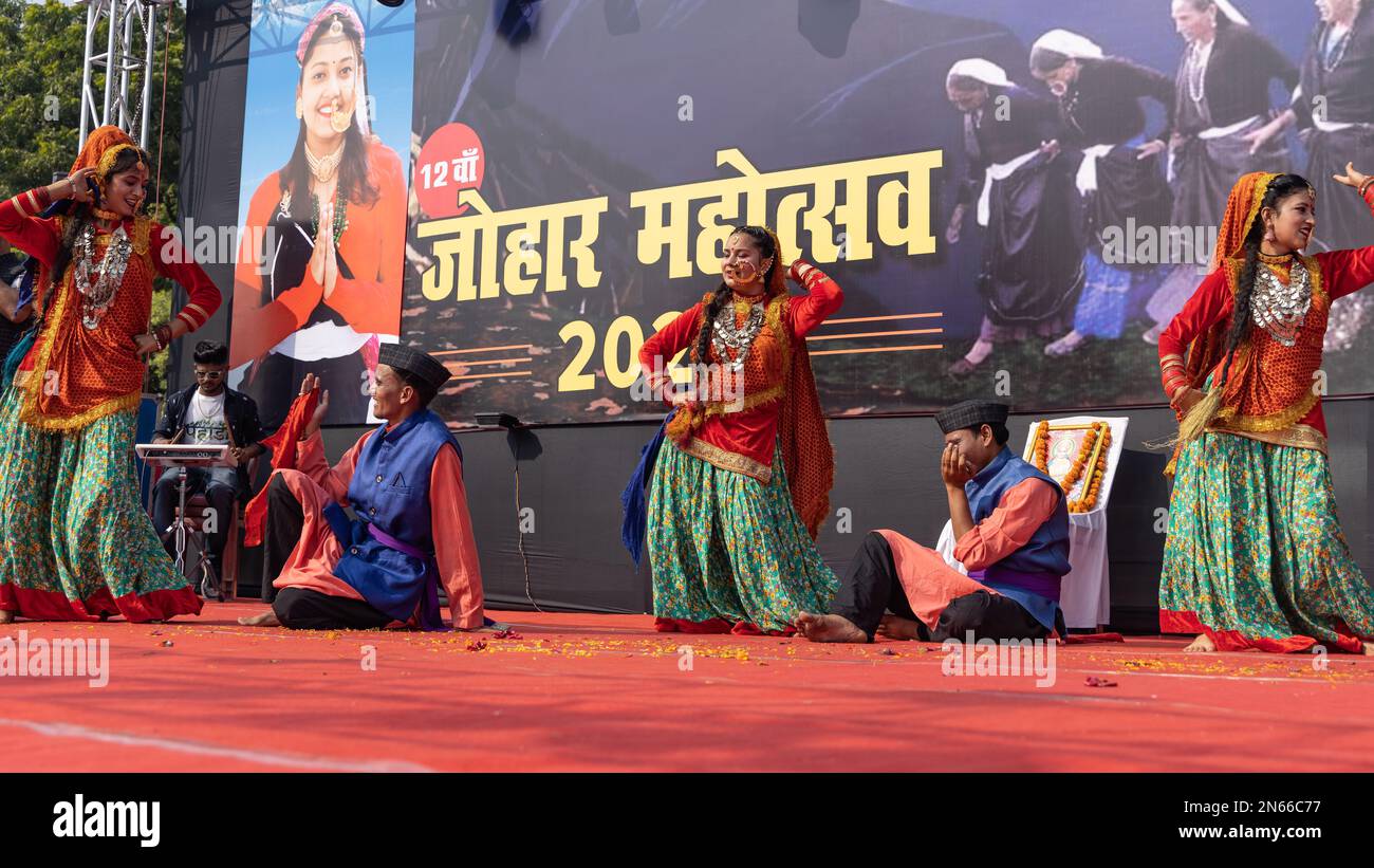 Tribal men and women wearing traditional attire dancing at the Johar ...