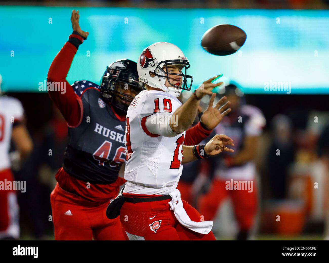 Ball State quarterback Keith Wenning (10) looks to pass as he is chased ...