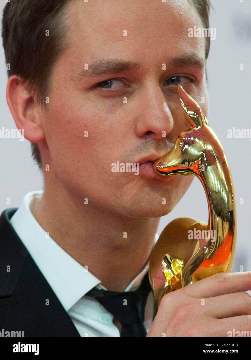 German actor Tom Schilling kisses the Bambi trophy for the best actor ...