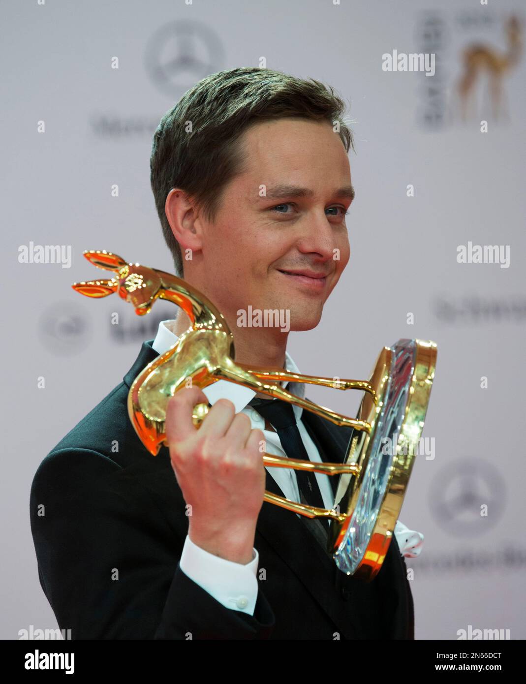 German actor Tom Schilling holds the Bambi trophy for the best actor ...