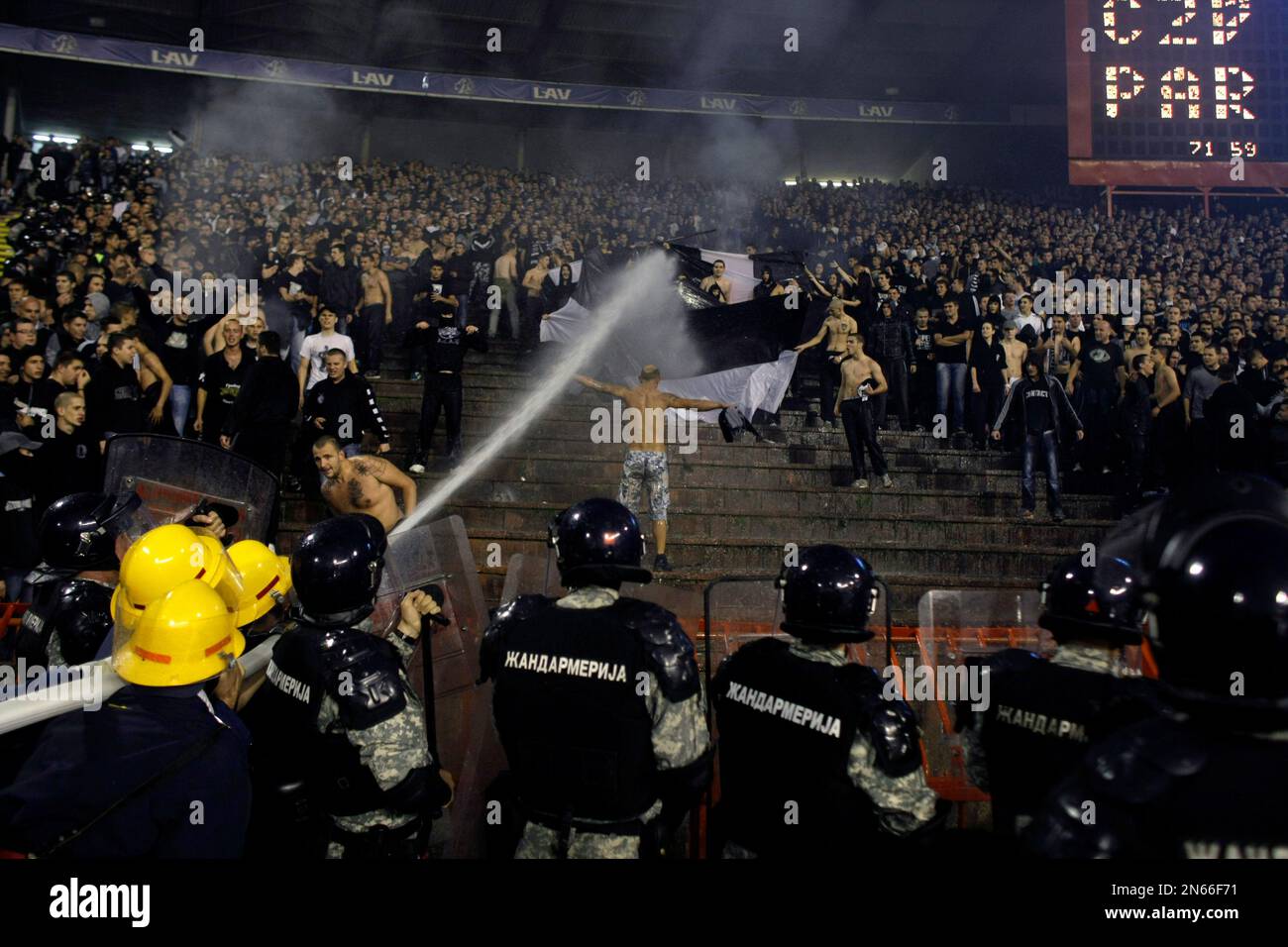 In this photo taken Saturday, Nov. 2, 2013, firemen try to extinguish ...