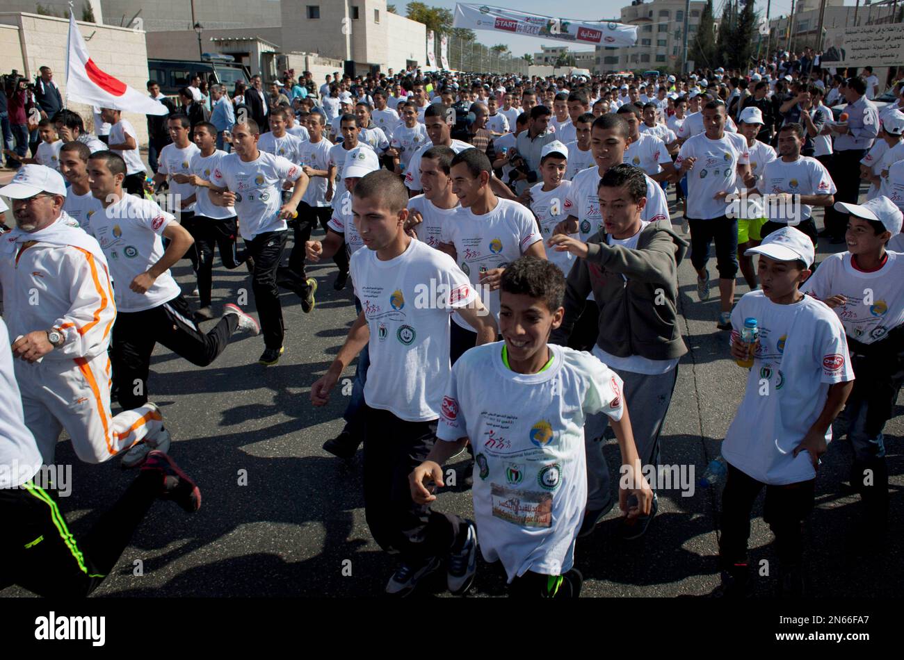 Palestinian runners leave the start line of the fourth Jerusalem ...