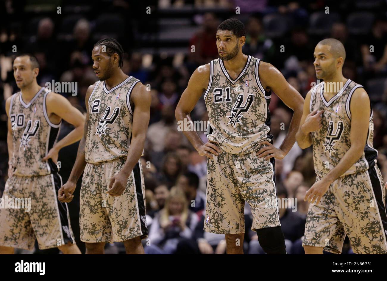 San Antonio Spurs' Tim Duncan (21) stands with teammates Manu Ginobili ...