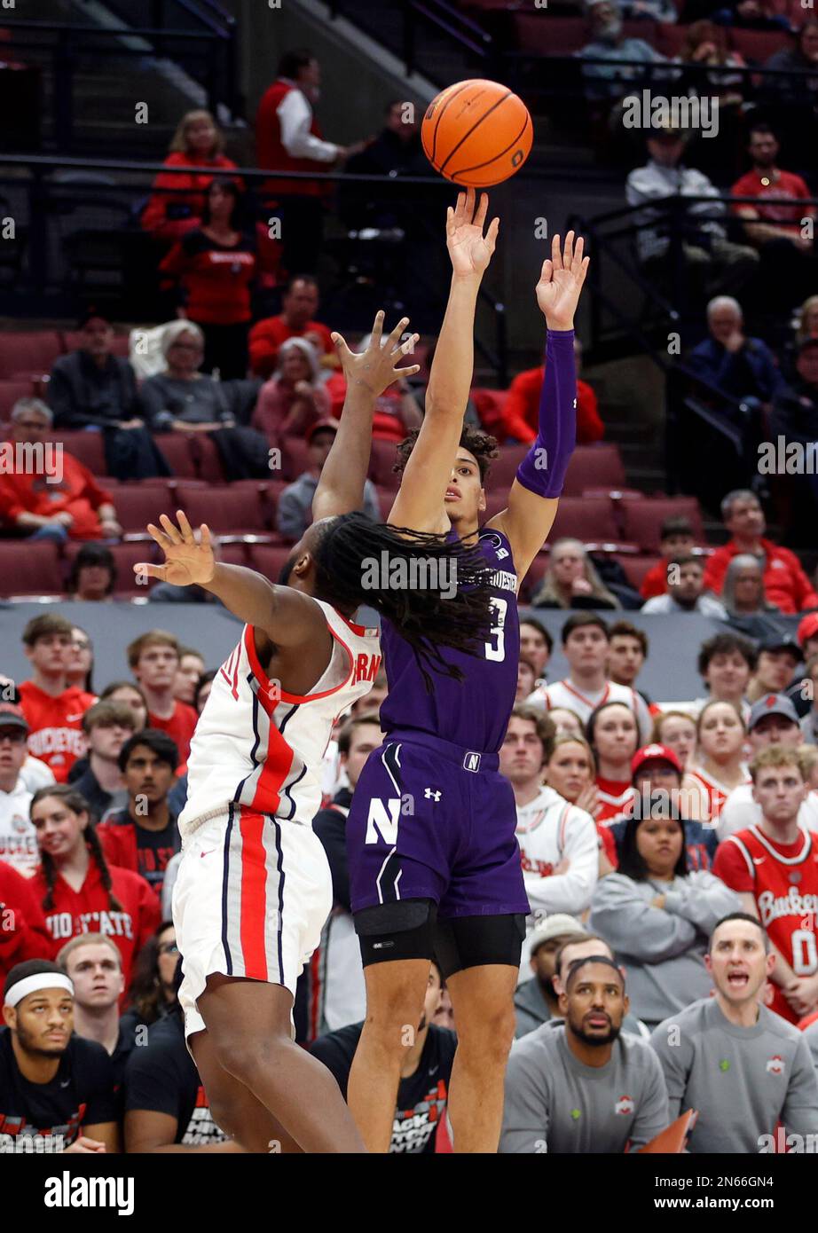 Northwestern guard Ty Berry, right, shoots next to Ohio State guard ...