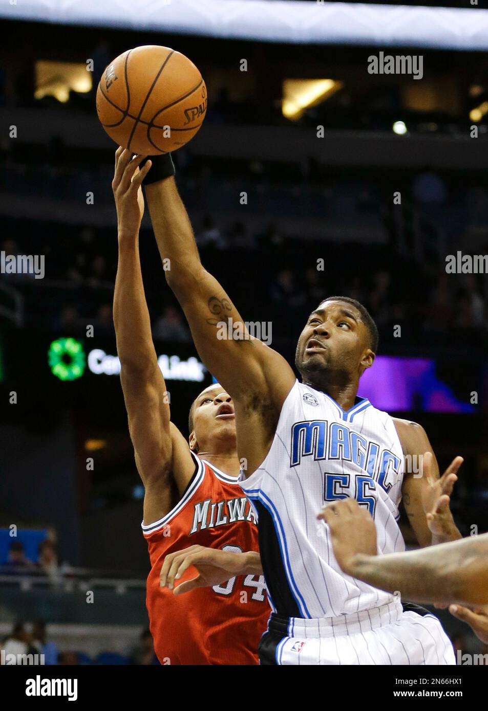 Orlando Magic's E'Twaun Moore, right, goes up for a rebound against ...
