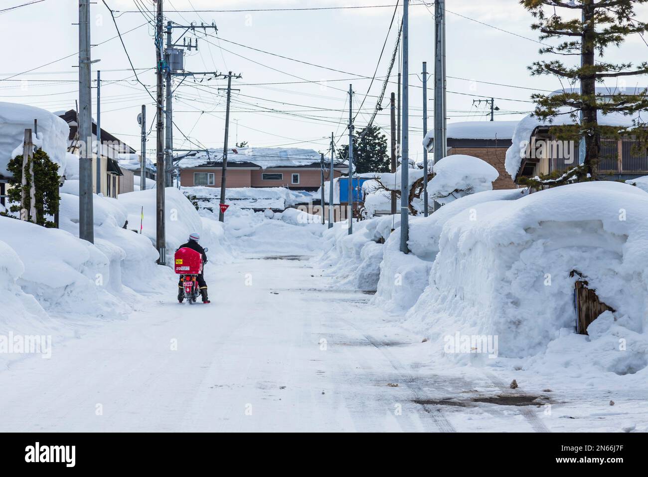 Postman with motorcycle, Life in a snow country, famous city by heavy ...
