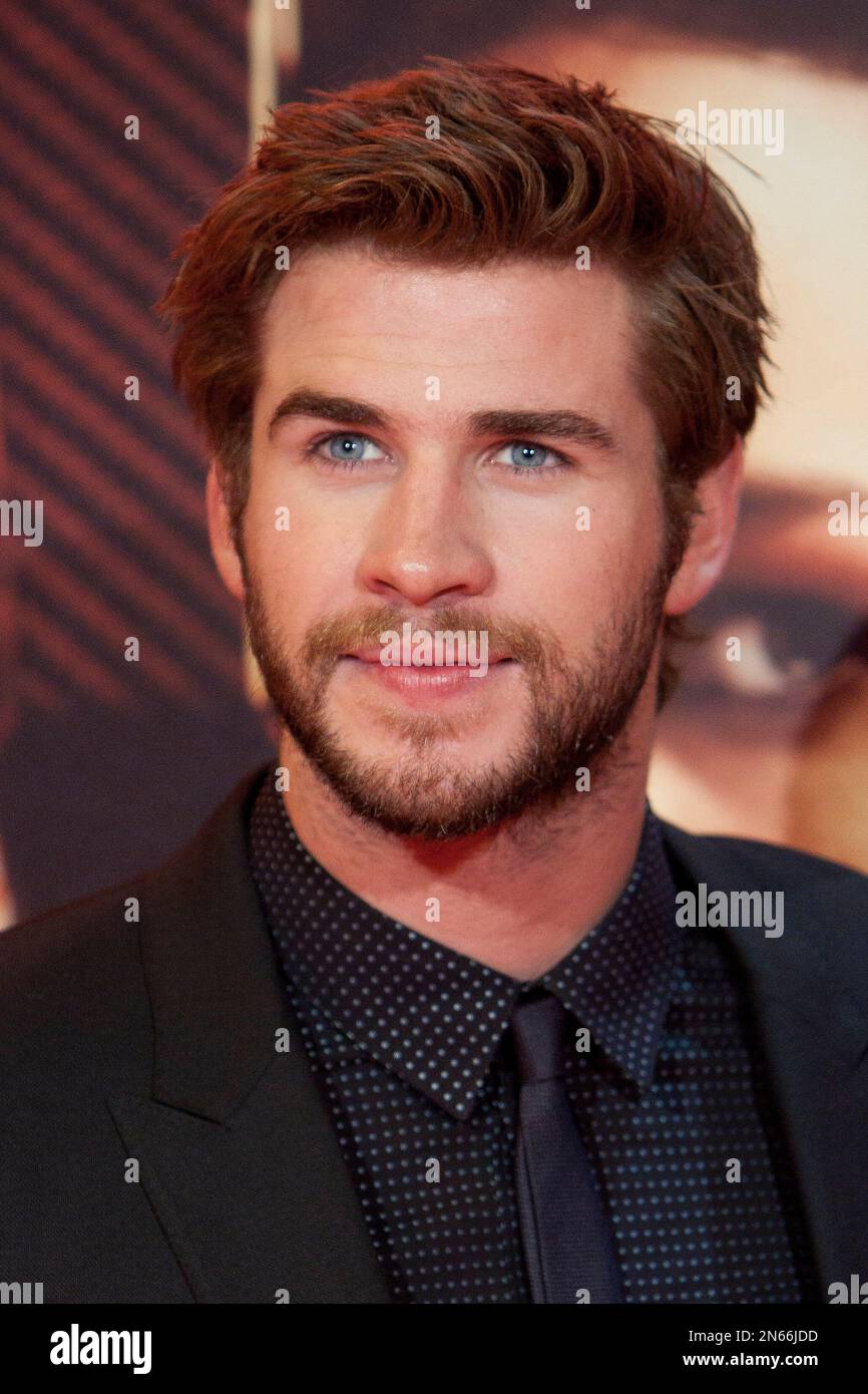 Australian actor Liam Hemsworth poses for the photographers during the ...