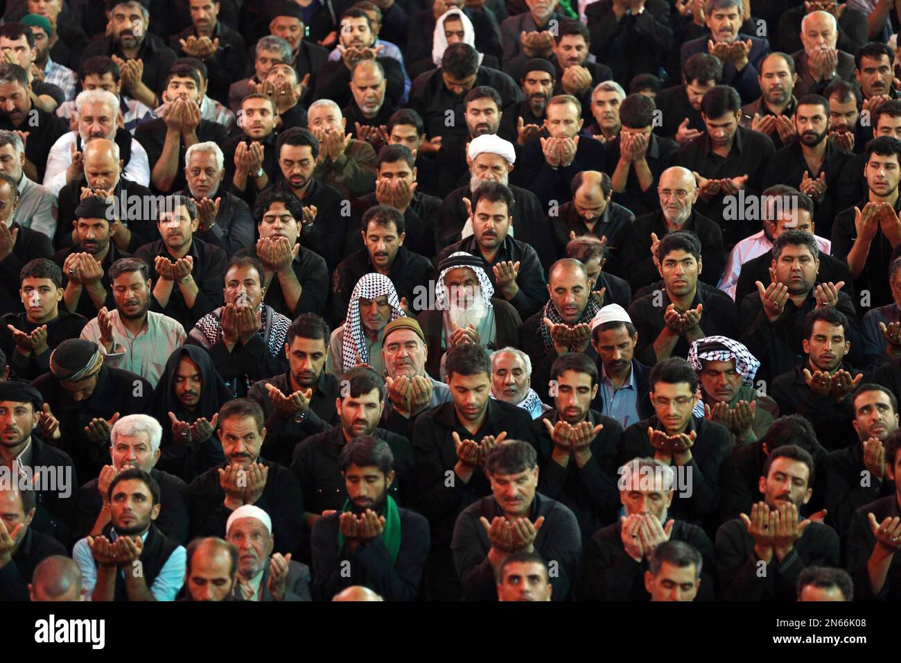 Shiite faithful worshippers pray inside the holy shrine of Imam Abbas ...