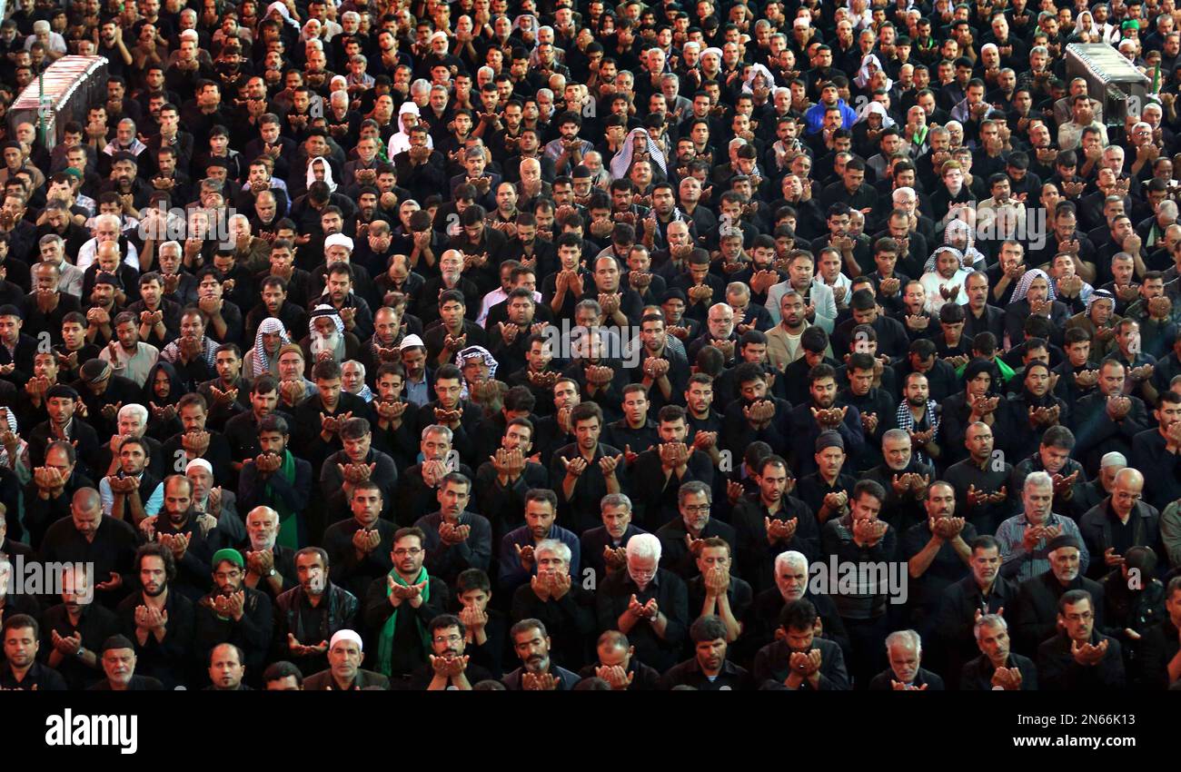 Shiite faithful worshippers pray inside the holy shrine of Imam Abbas ...