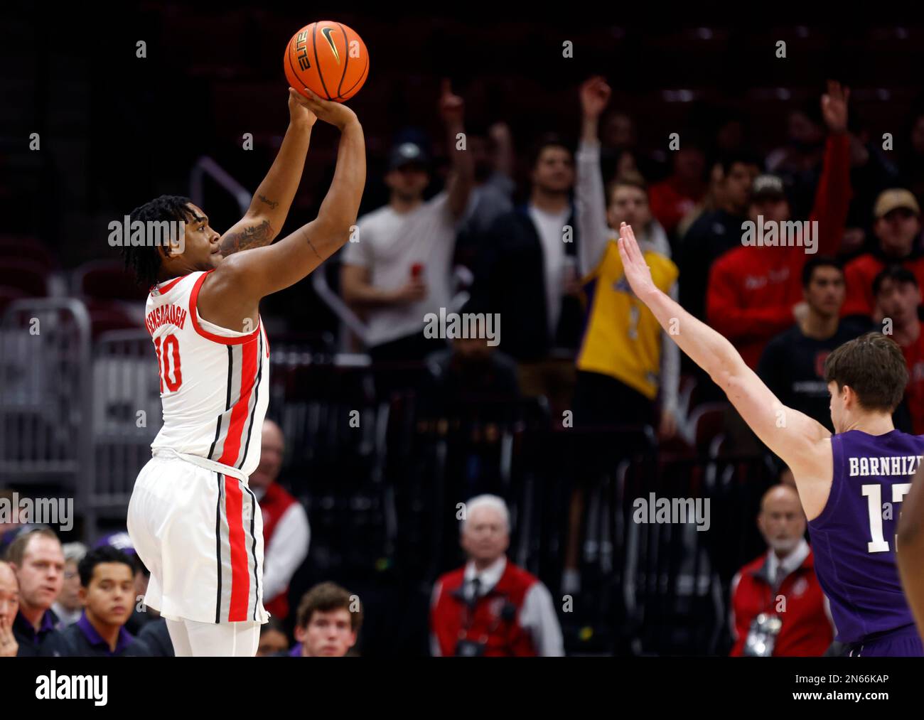Ohio State forward Brice Sensabaugh, left, shoots in front of ...