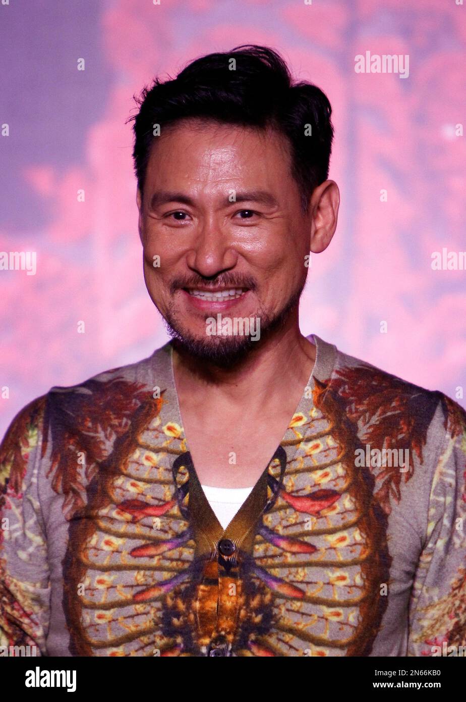 Hong Kong singer Jacky Cheung smiles as he poses for photographers ...