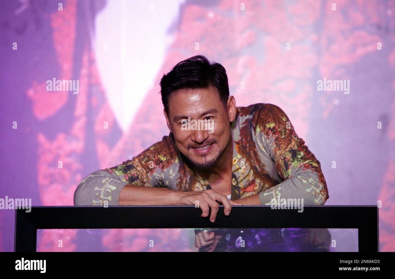 Hong Kong singer Jacky Cheung poses for photographers during a press ...