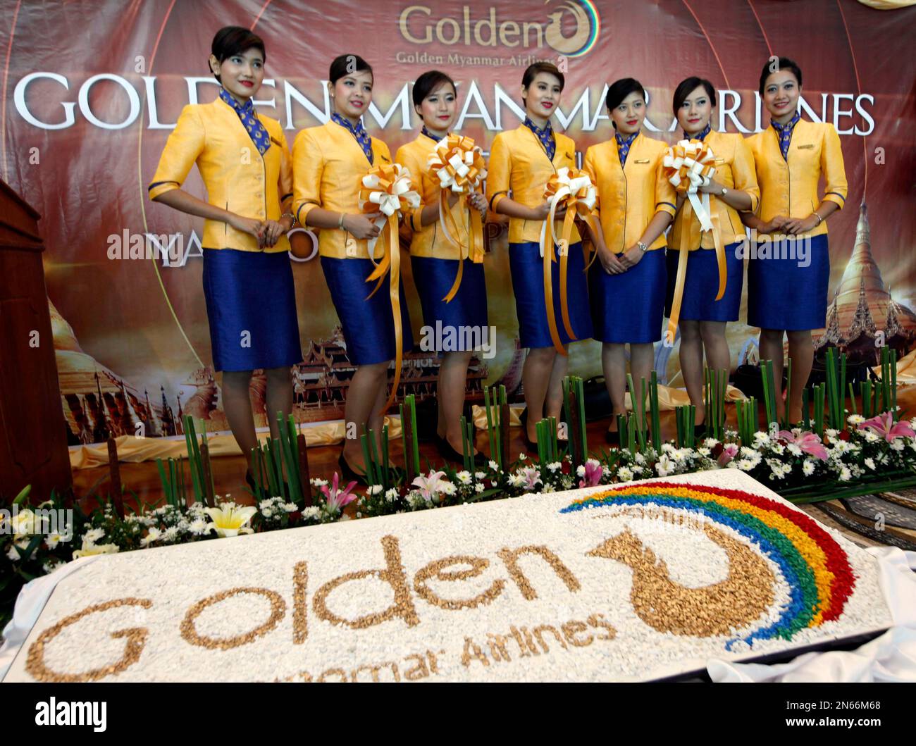 Flight attendants from Golden Myanmar Airlines pose for photos during ...