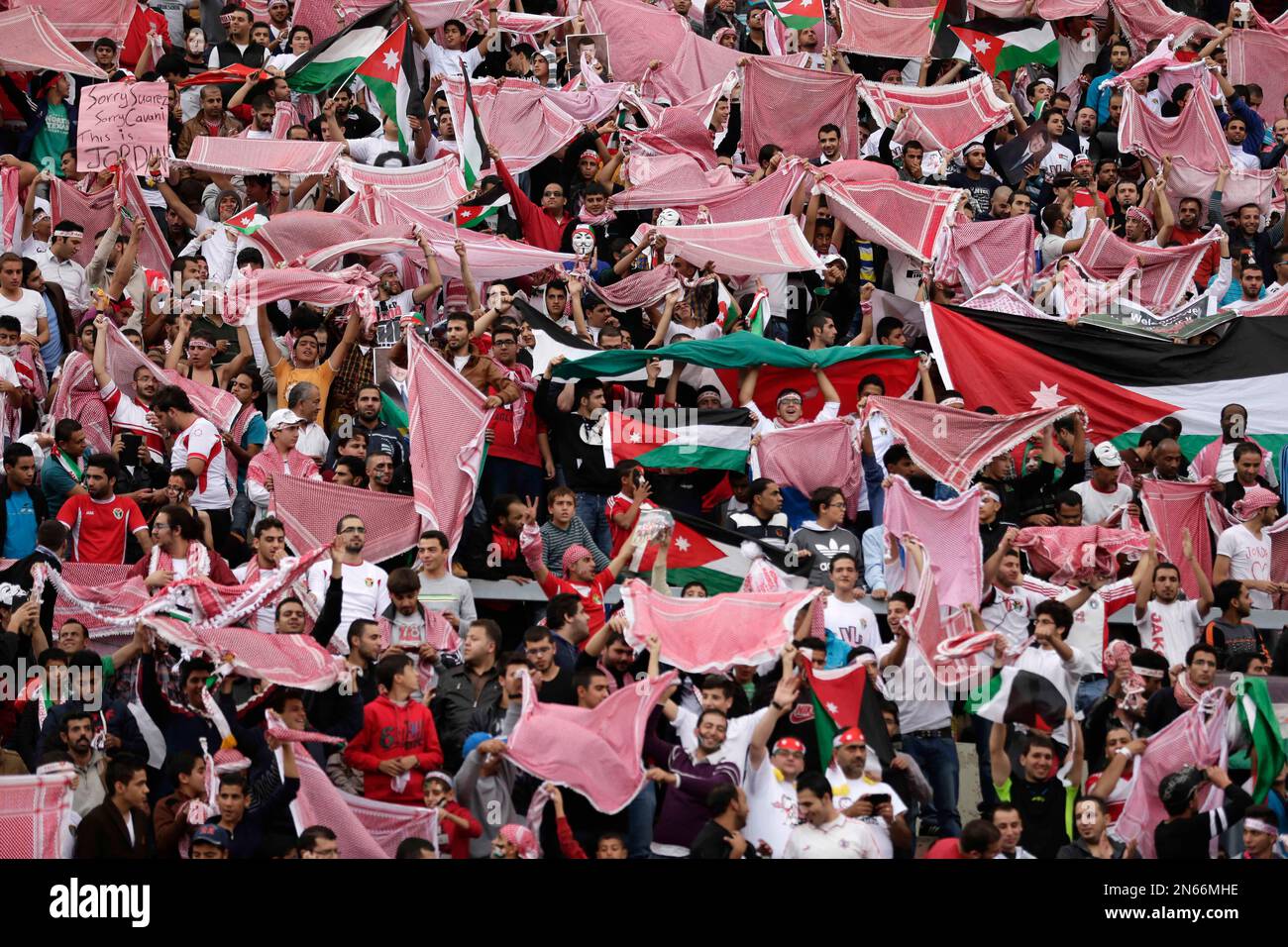 Jordanian fans cheer for their team before the World Cup playoff first ...