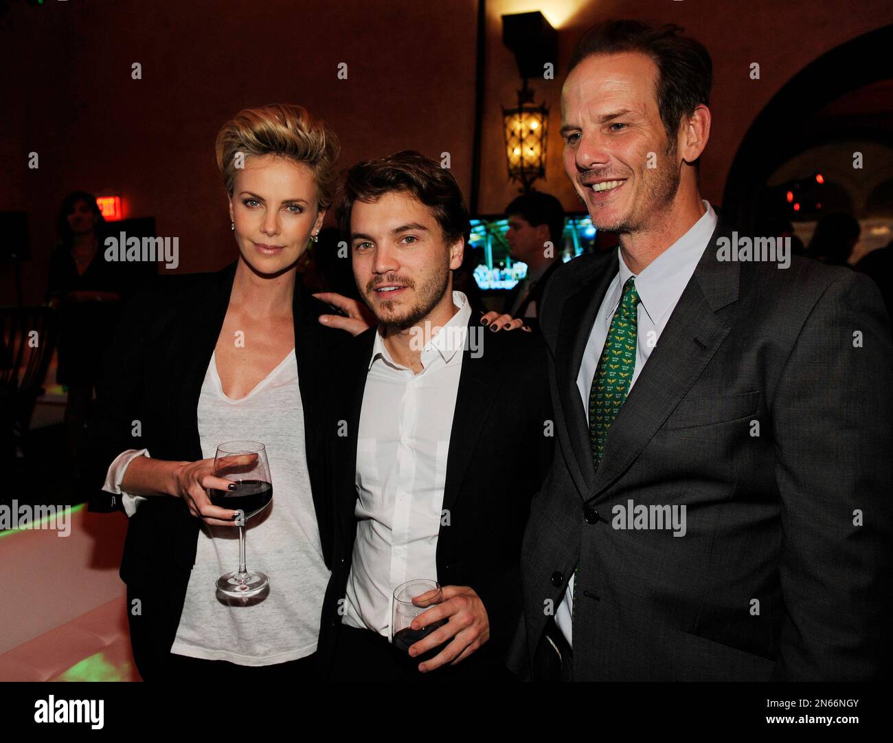 Peter Berg, right, writer/director/producer of "Lone Survivor," poses ...