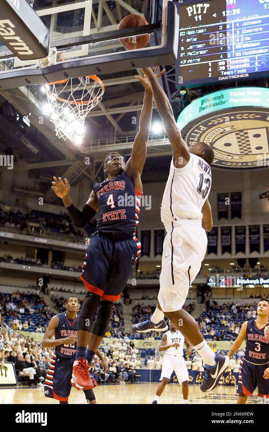 Pittsburgh's Josh Newkirk (13) shoots over Fresno State's Karachi Edo ...