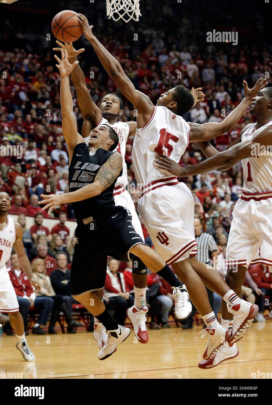 Indiana forwards Jeremy Hollowell, left, and Devin Davis, right, block ...