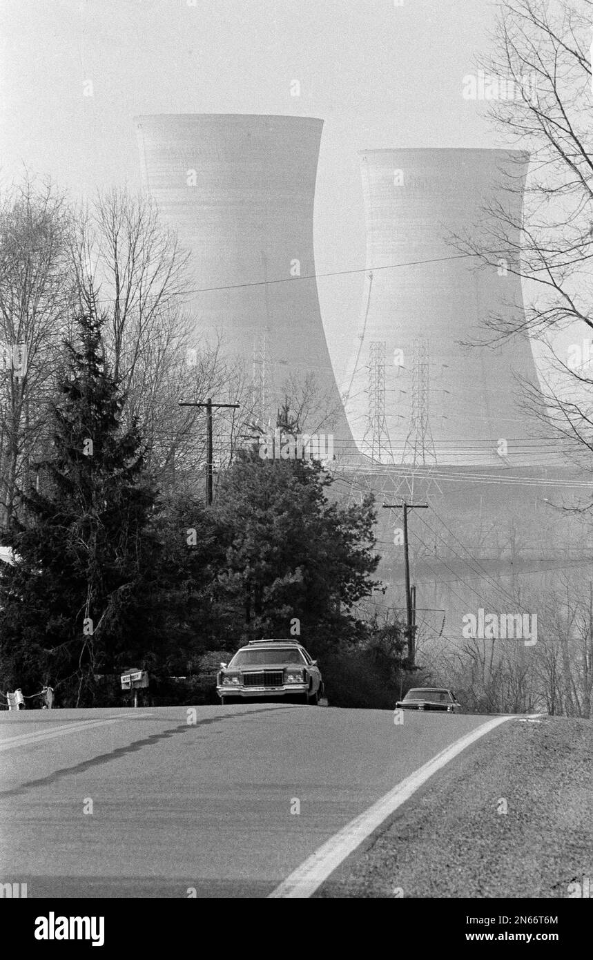 Autos travel a road away from the Three Mile Island Nuclear Power Plant ...