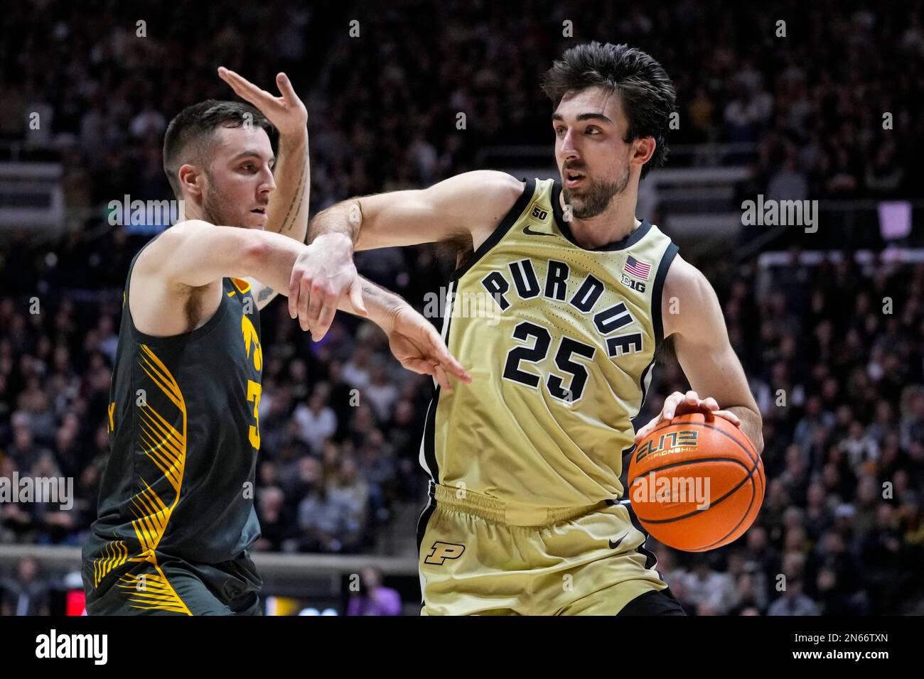 Purdue guard Ethan Morton (25) tries to get past Iowa guard Connor ...