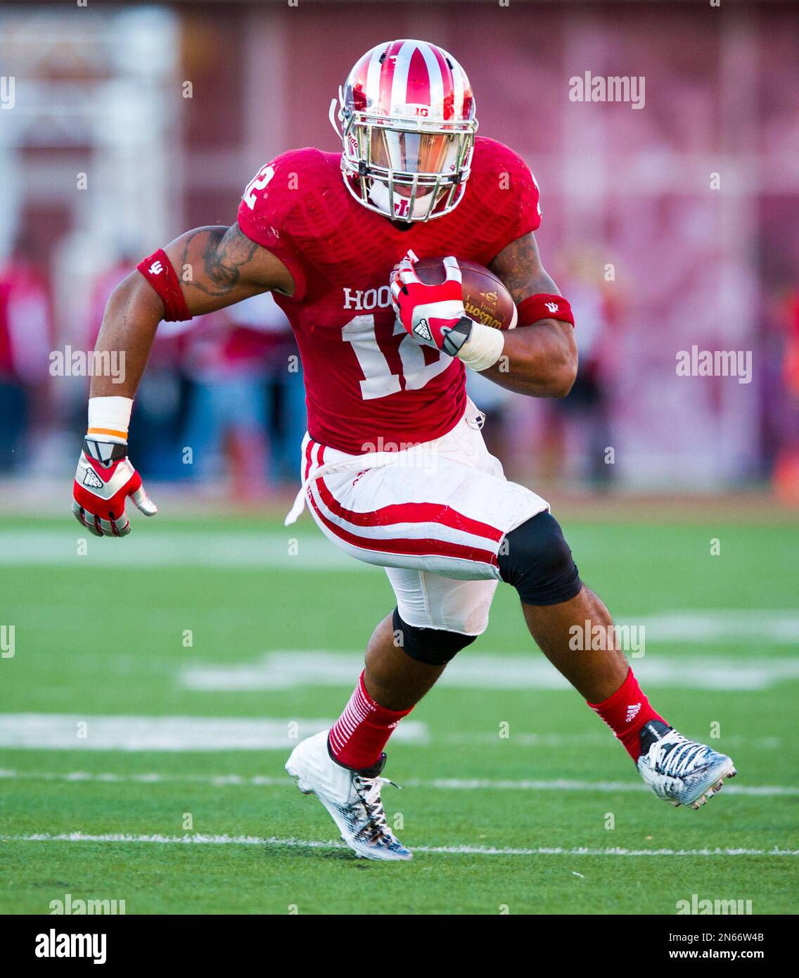 Indiana running back Stephen Houston (12) rushes the ball upfield ...