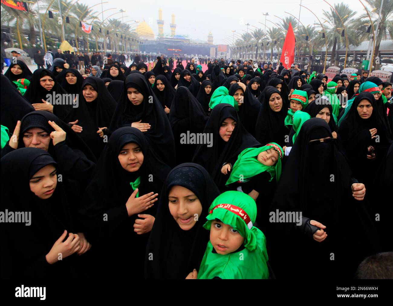 Shiite faithful worshippers gather outside Imam Abbas shrine, seen in ...