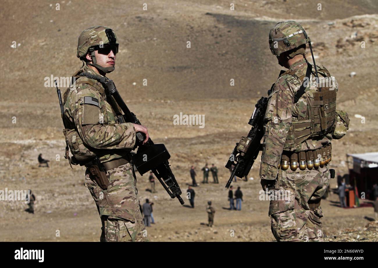 International security assistance forces ISAF look at alcohol cans and ...