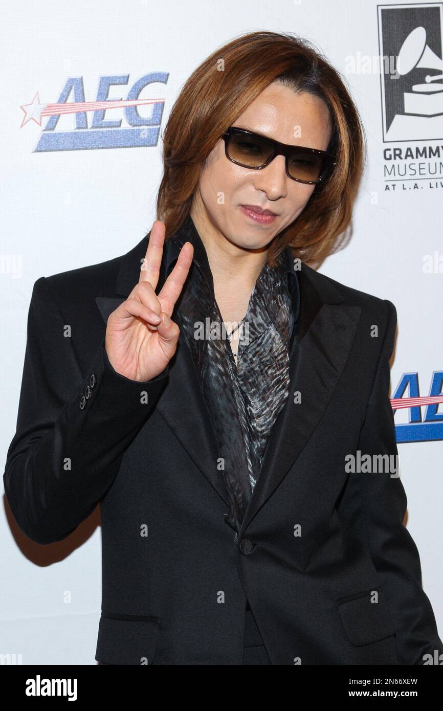 Yoshiki arrives at the GRAMMY Museum gala tribute concert on Monday, Nov. 11, 2013 in Los ...