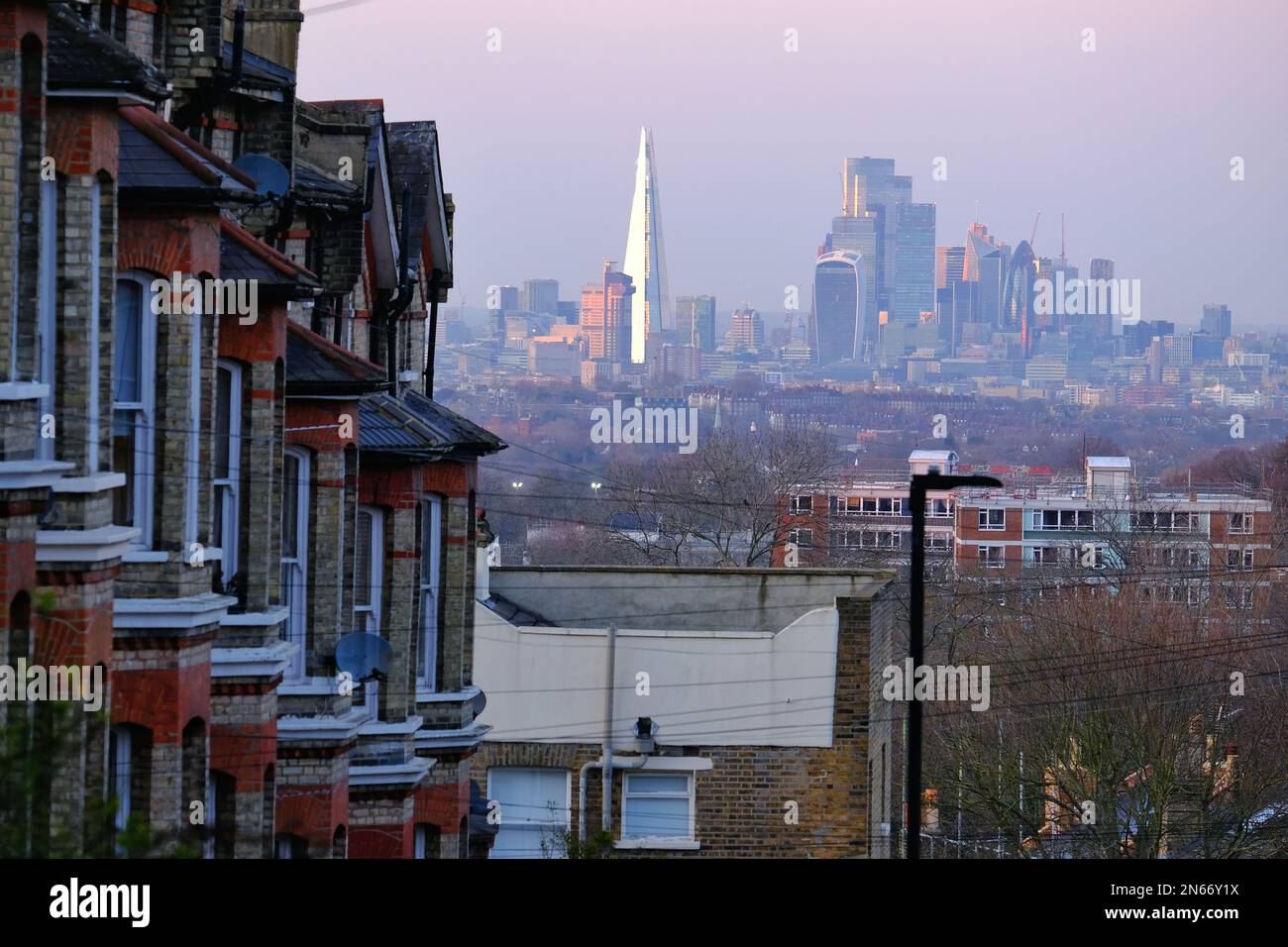London, UK. A street view of Crystal Palace at dusk, with the Shard and ...