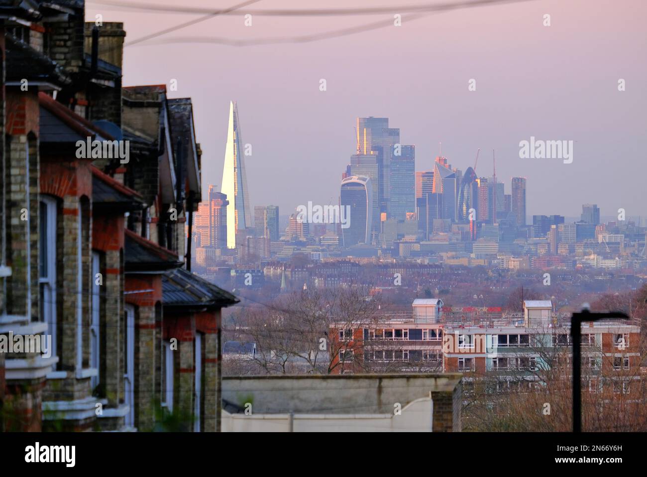 London, UK. A street view of Crystal Palace at dusk, with the Shard and ...