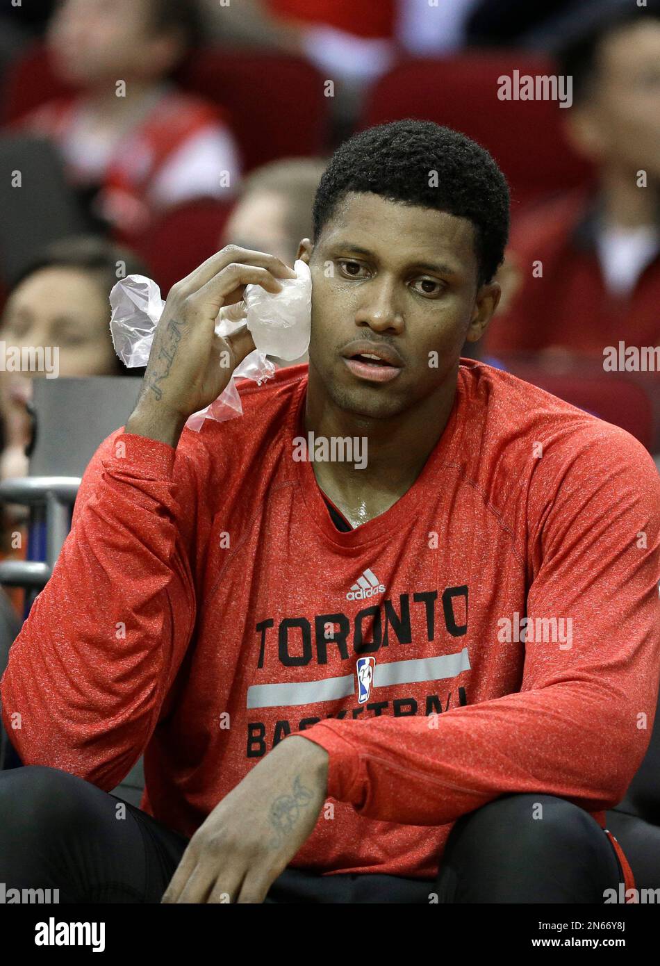Toronto Raptors' Rudy Gay holds an ice pack to his face in the second ...