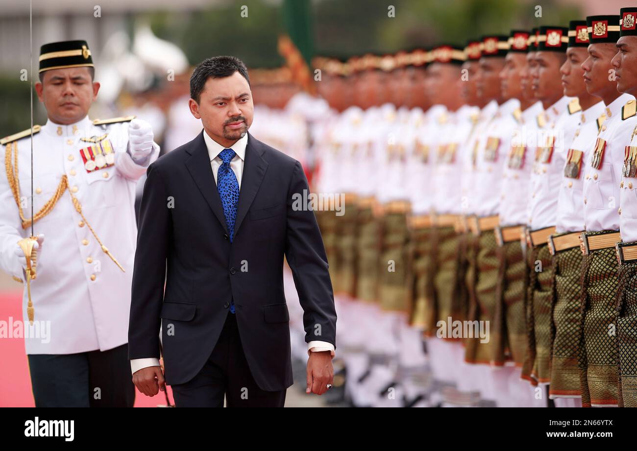 Brunei's Crown Prince Al-Muhtadee Billah, second from left, inspects an ...