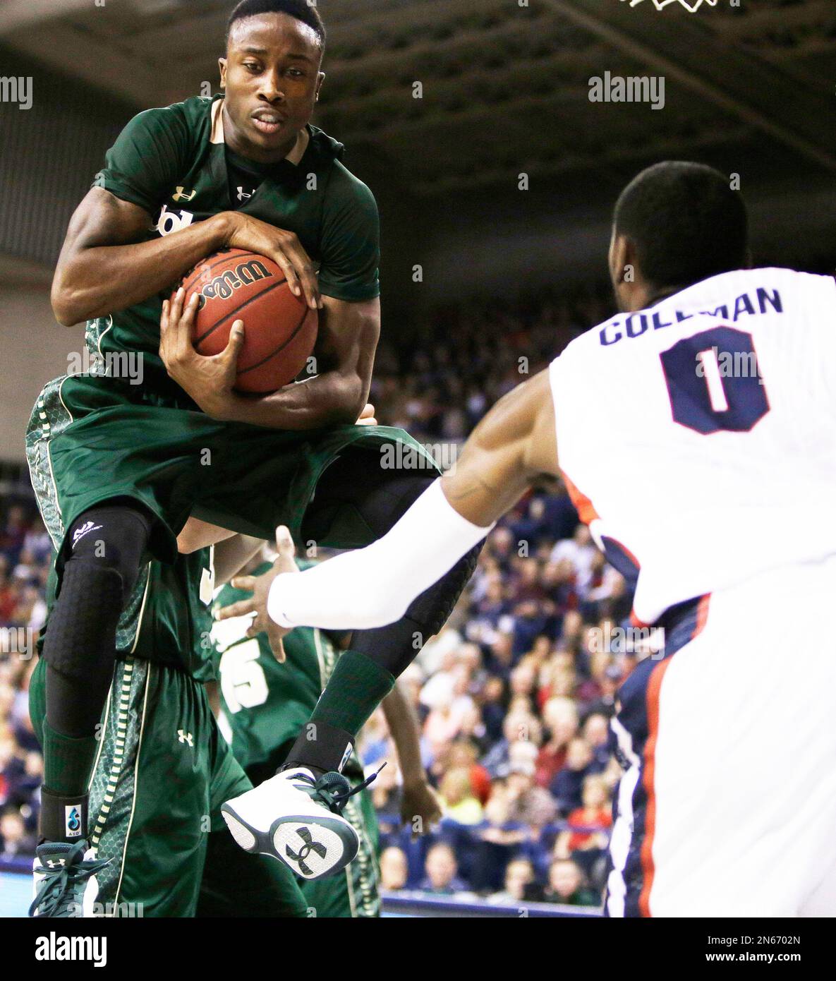 Colorado State's Jon Octeus, left, grabs a rebound during the first ...