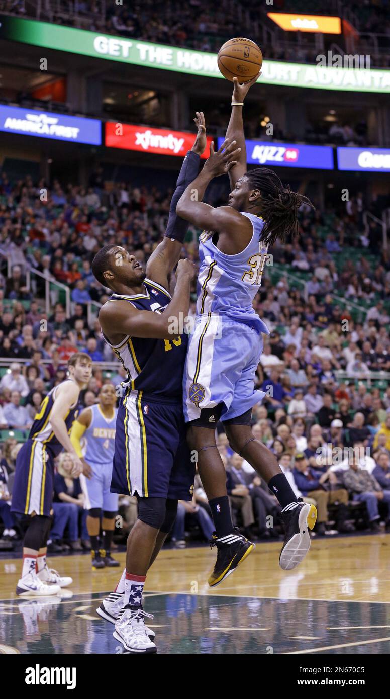 Denver Nuggets' Kenneth Faried (35) shoots as Utah Jazz's Derrick ...