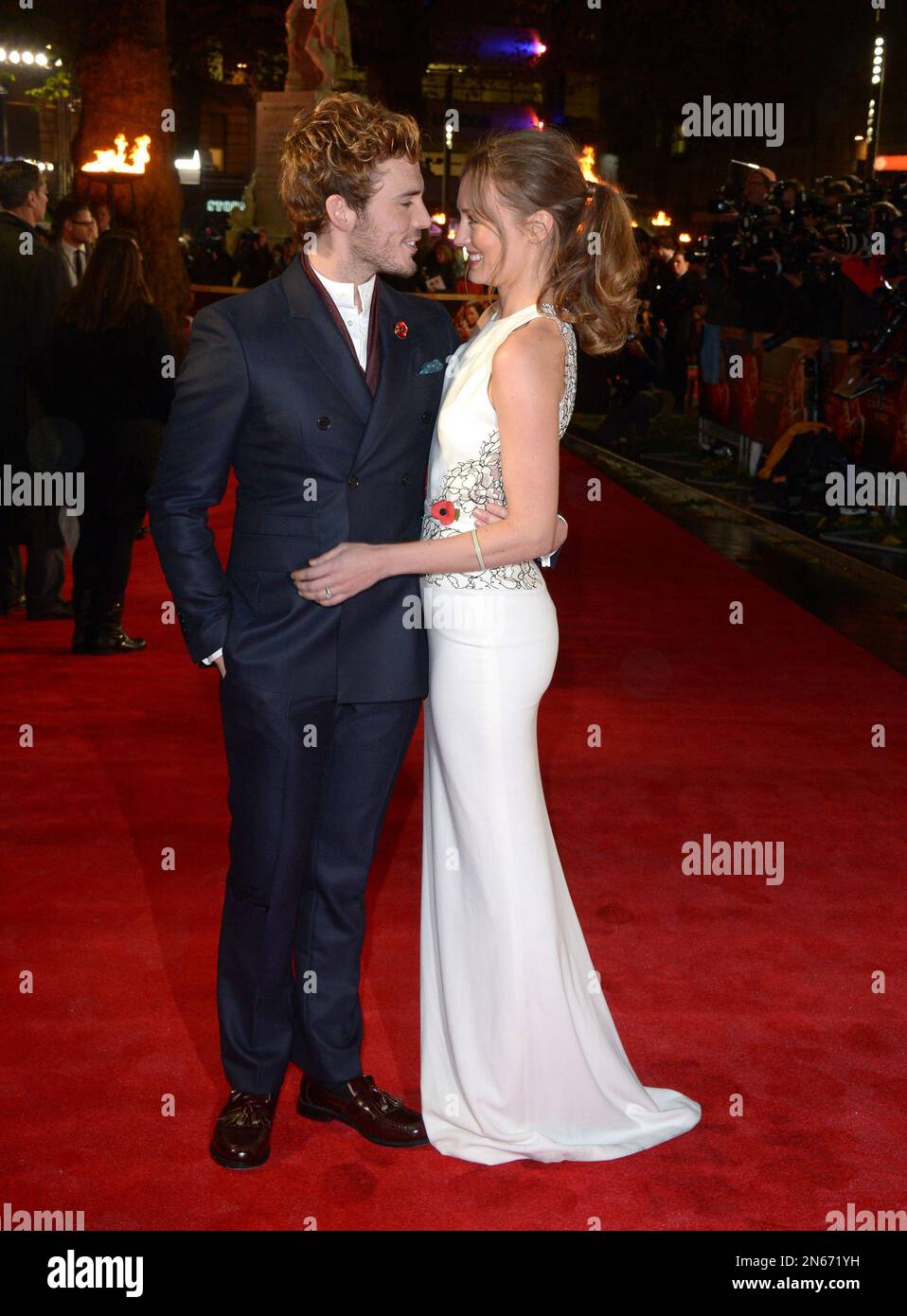 Actor Sam Claflin and Laura Haddock pose for photographers as they ...