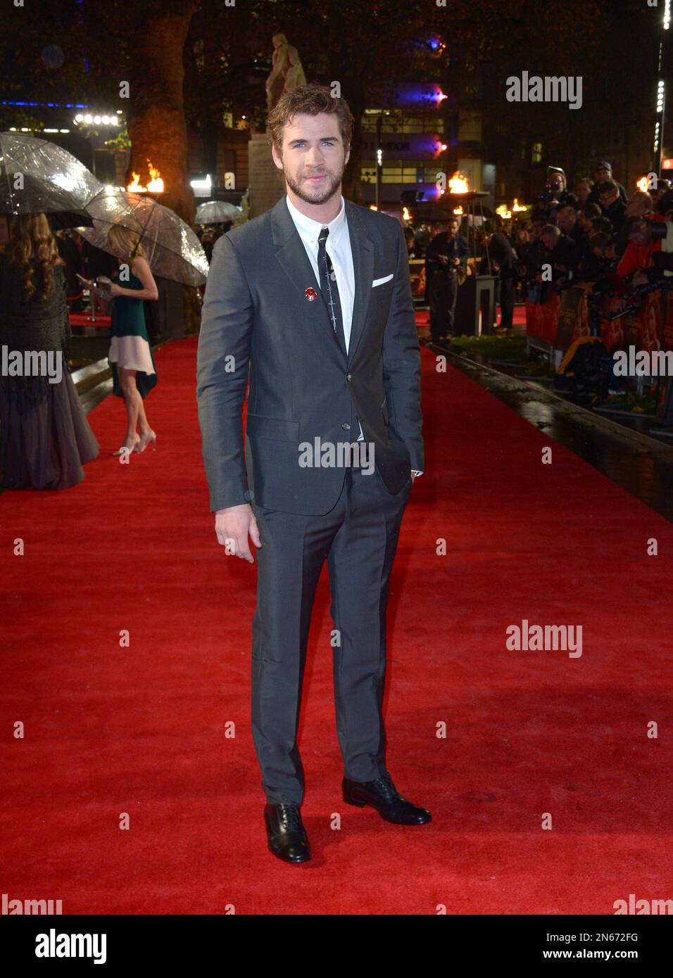 Australian actor Liam Hemsworth poses for photographers as he arrives ...