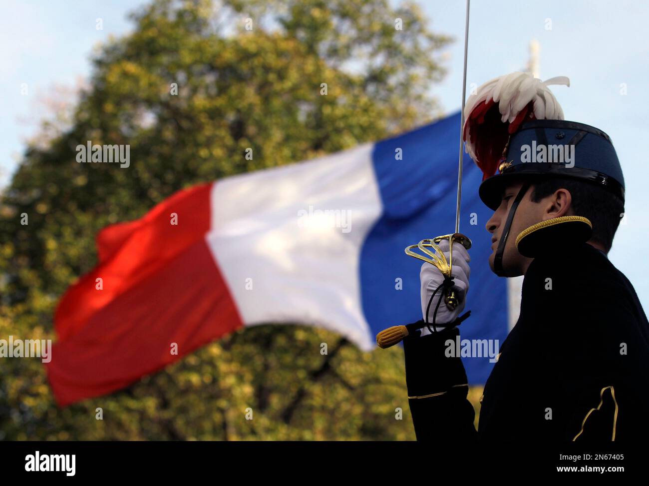 A French army soldier salutes during a ceremony marking Armistice Day ...