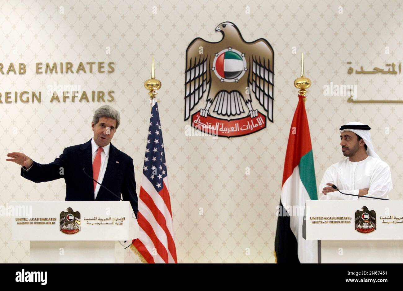 U.S. Secretary of State John Kerry, left, talks with a journalist as ...
