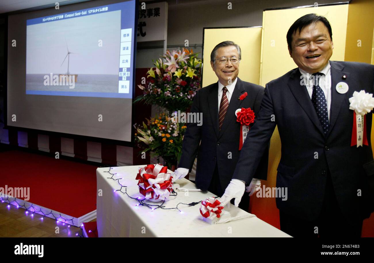 Japan's State Minister of Economy, Trade and Industry Kazuyoshi Akaba, right, and Fukushima Gov ...