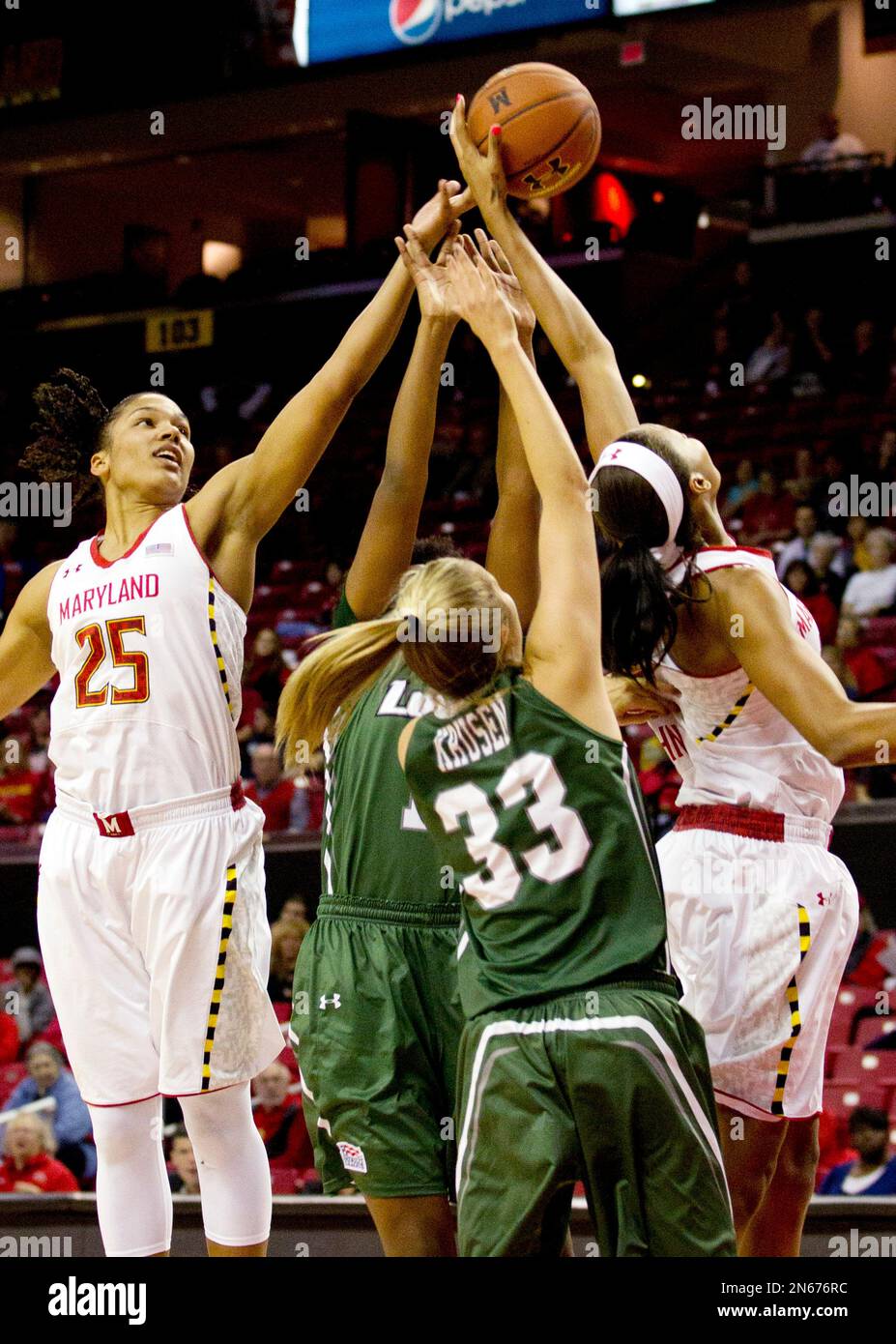 Maryland's Alyssa Thomas (25) and Alicia DeVaughn, right, recover the ...