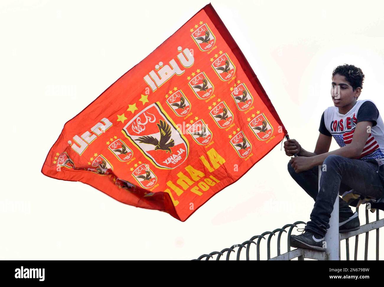 An Egyptian club Al Ahly fan waves an Al Ahly flag during the African ...