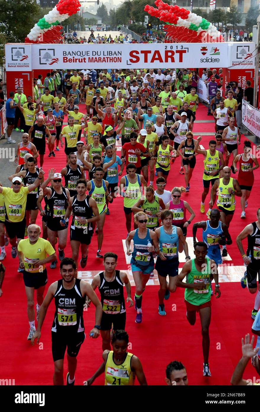 Runners compete in the 42 kilometer (26 mile) Beirut International ...