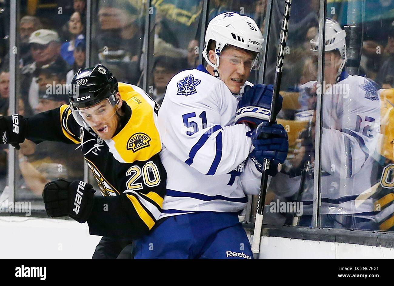 Boston Bruins' Daniel Paille (20) checks Toronto Maple Leafs' Jake ...