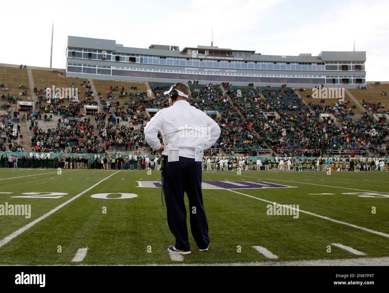 Nevada head coach Brian Polian stands on the side line during an NCAA ...
