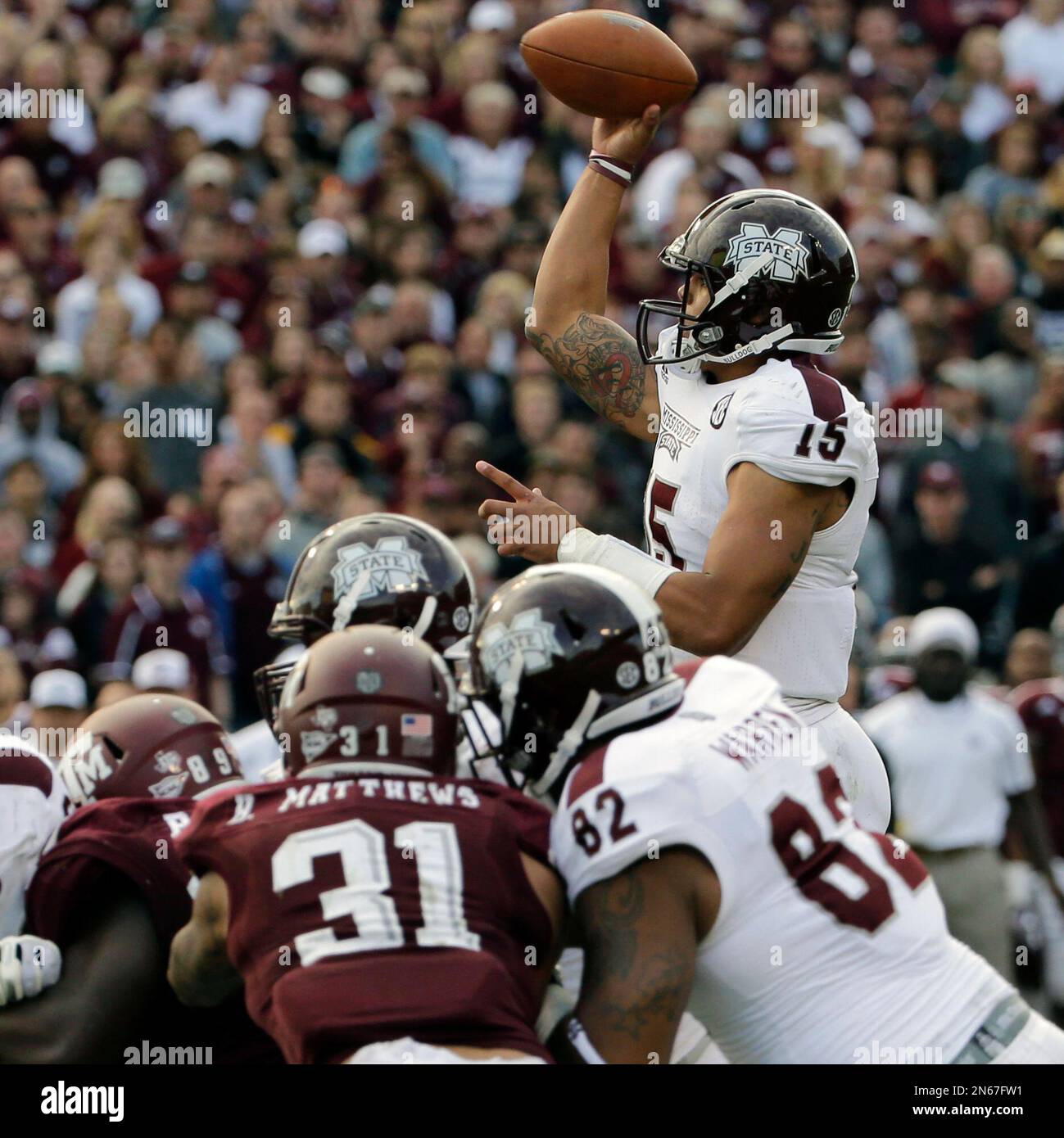 Mississippi State quarterback Dak Prescott (15) jumps up to throw a ...