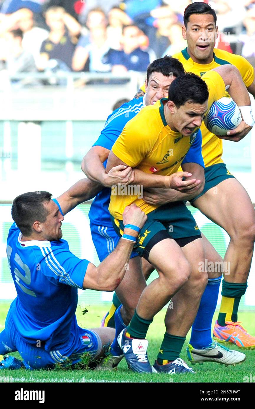 Australian fly half Matt Toomua challenges for the ball with Italian ...